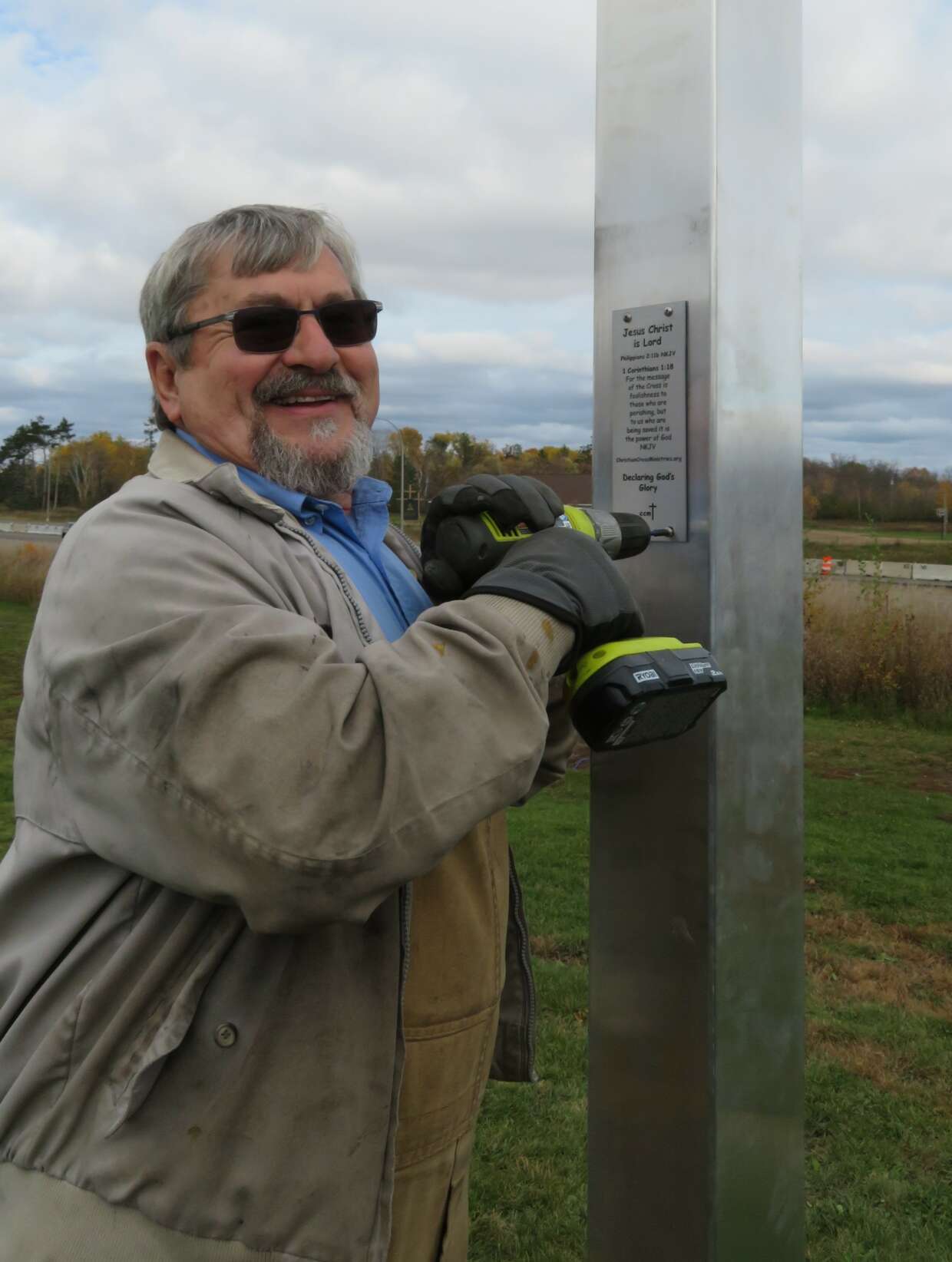 Pastor Reed Attaching Plaque | Christian Cross Ministries