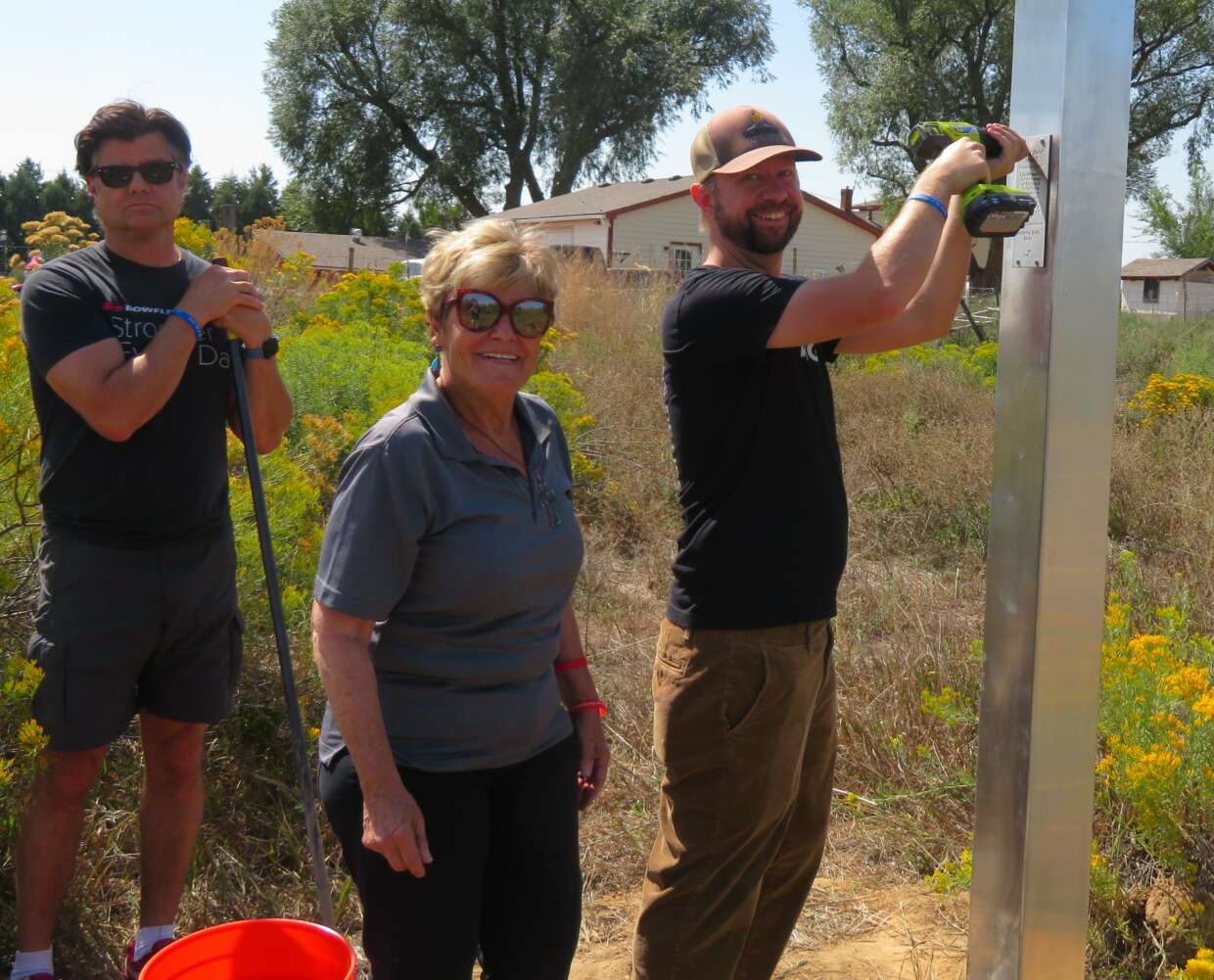 Pastor Josh Attaching Plaque | Christian Cross Ministries
